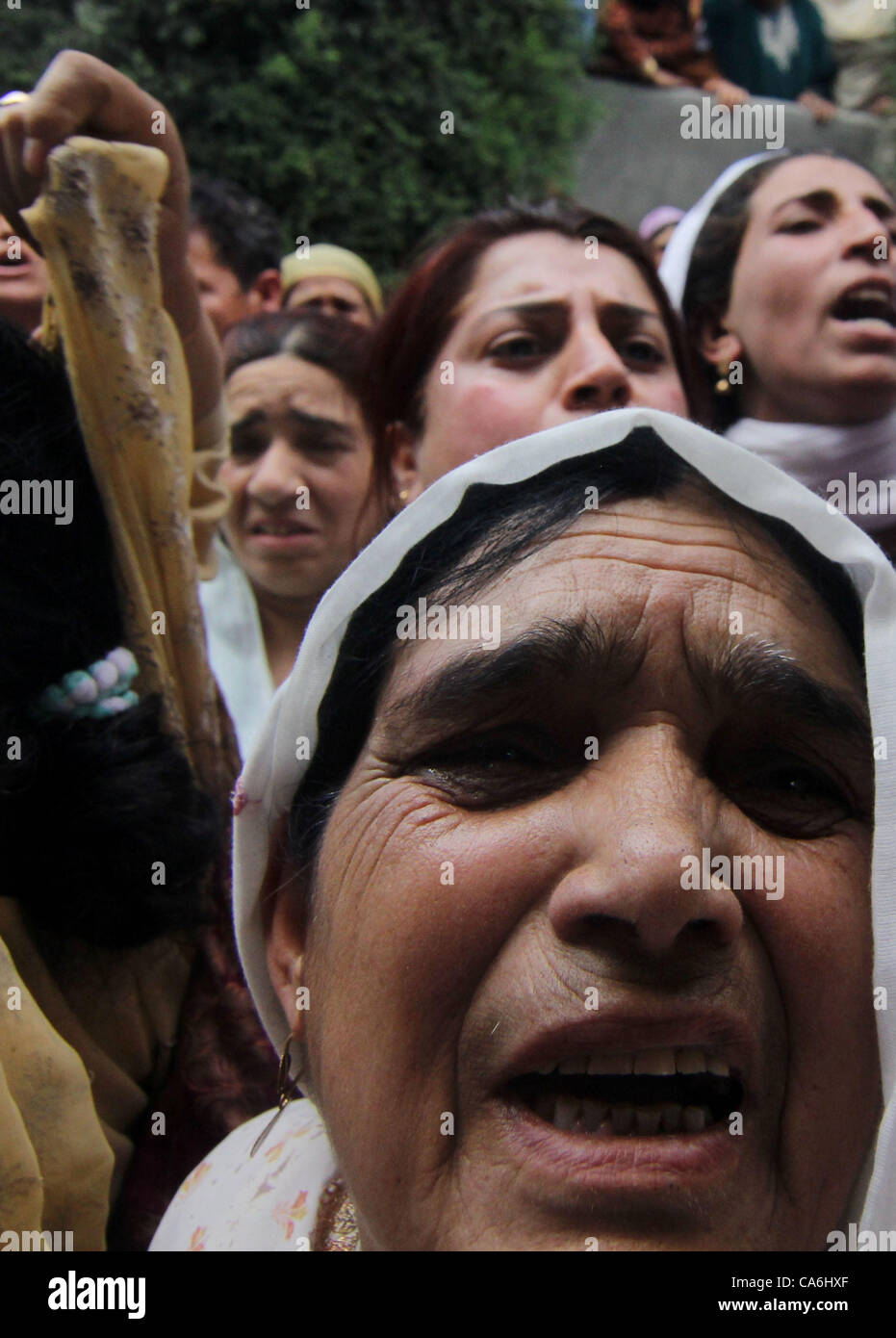 An Kashmiri Muslim women wail during the funeral procession of ruling ...