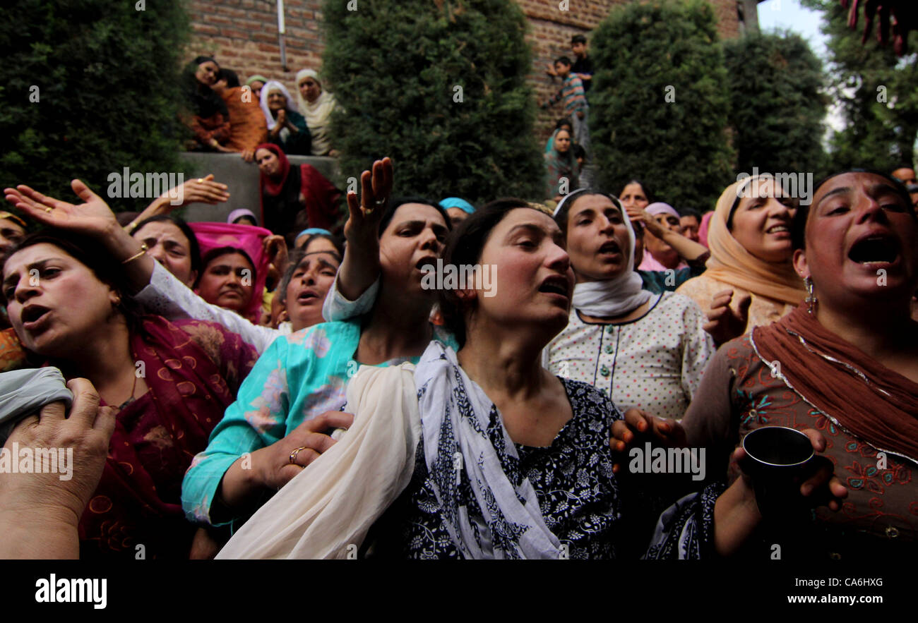 An Kashmiri Muslim women wail during the funeral procession of ruling ...