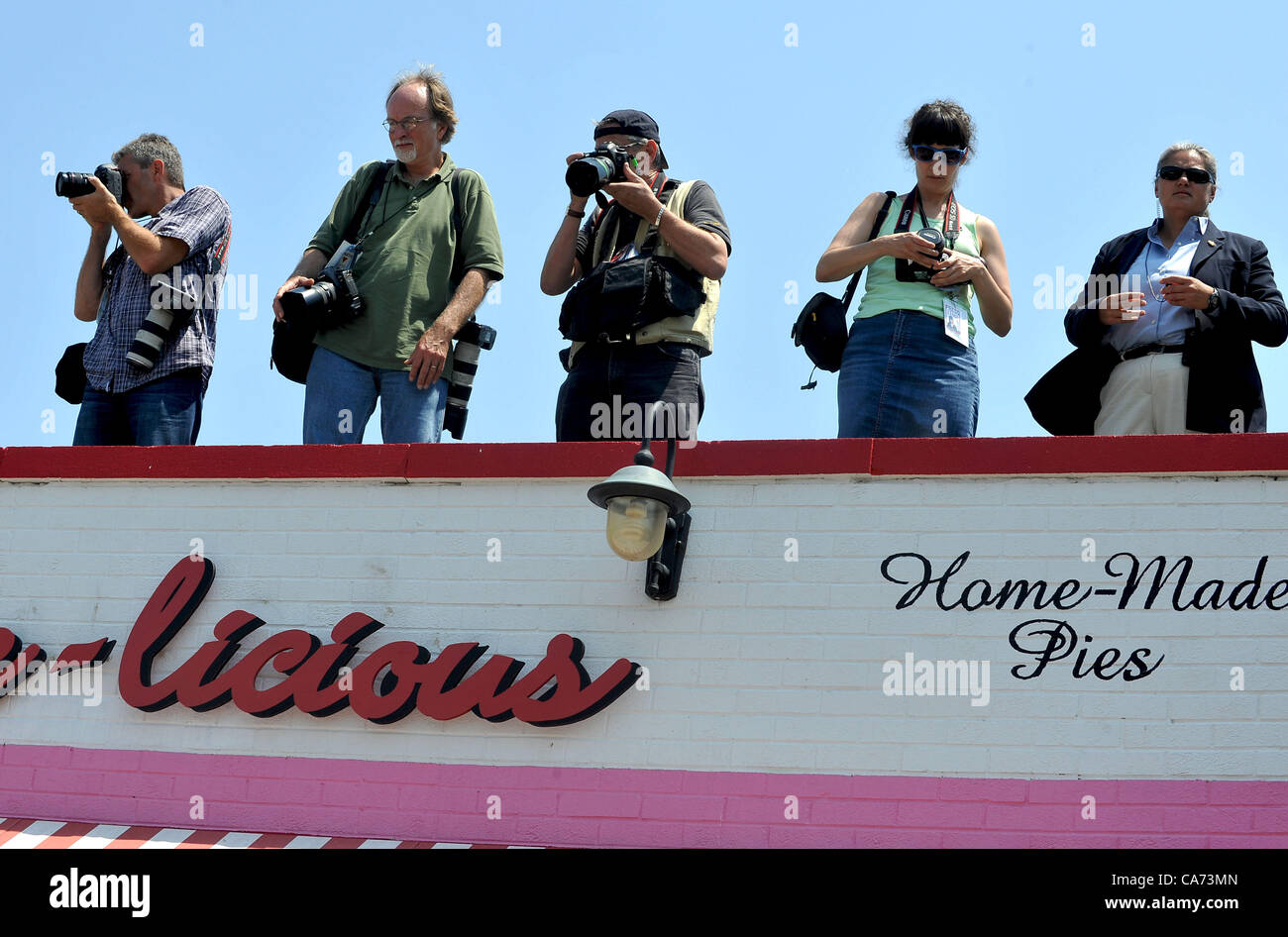 June 19, 2012 - Dewitt, MI, U.S - Pool photographers stand atop the ...