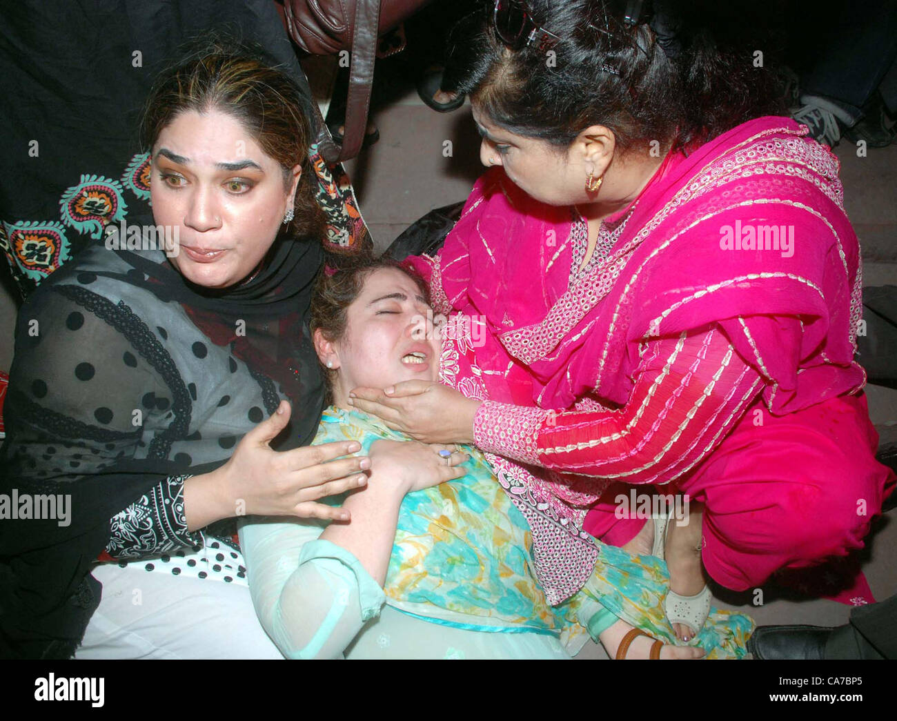 Opposition members hold their unconscious member after clash between ...