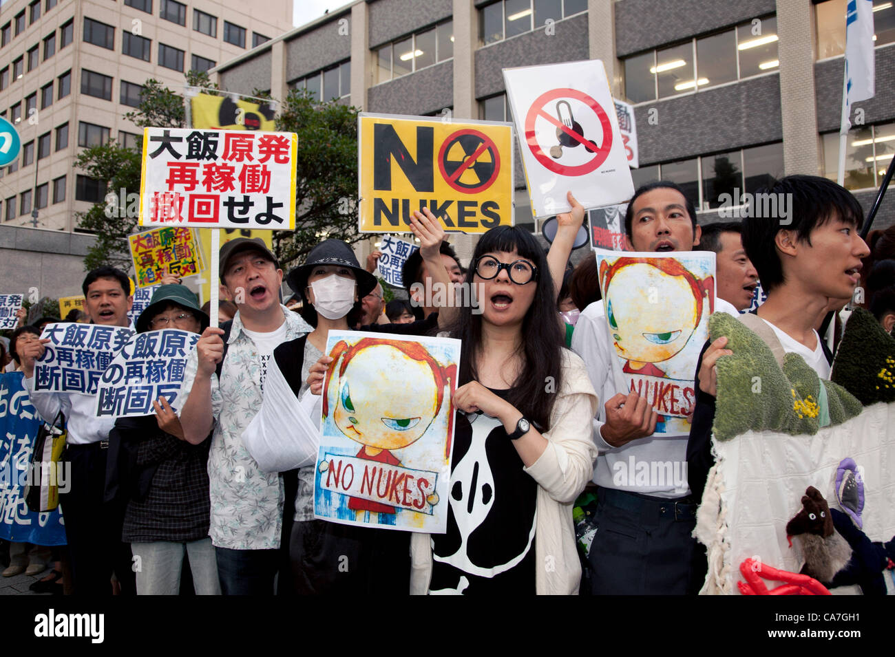 June 22nd 2012, Tokyo, Japan - Demonstrators show "NO NUKES" signs ...