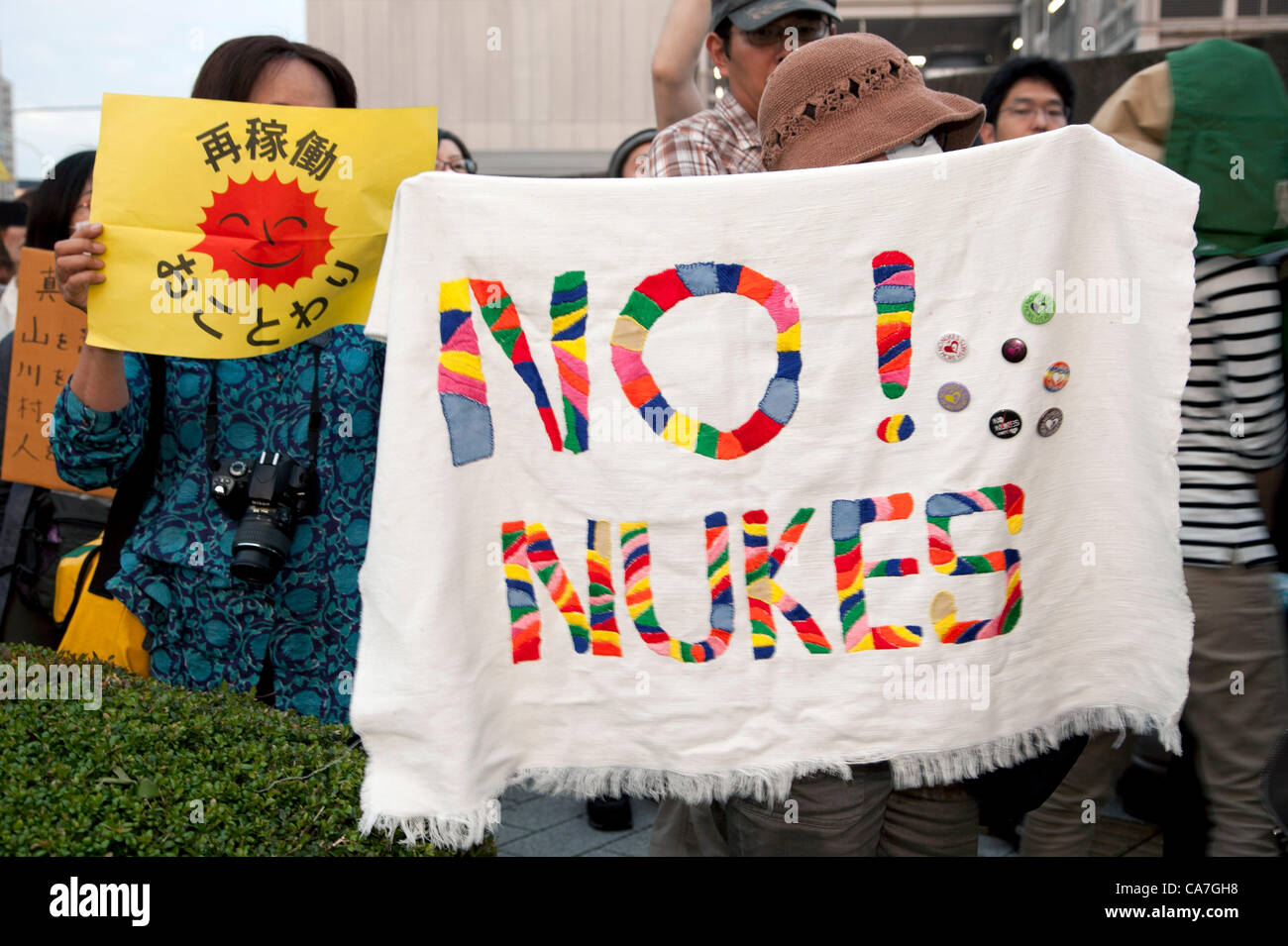 June 22nd 2012, Tokyo, Japan - Demonstrators show "NO NUKES" signs ...