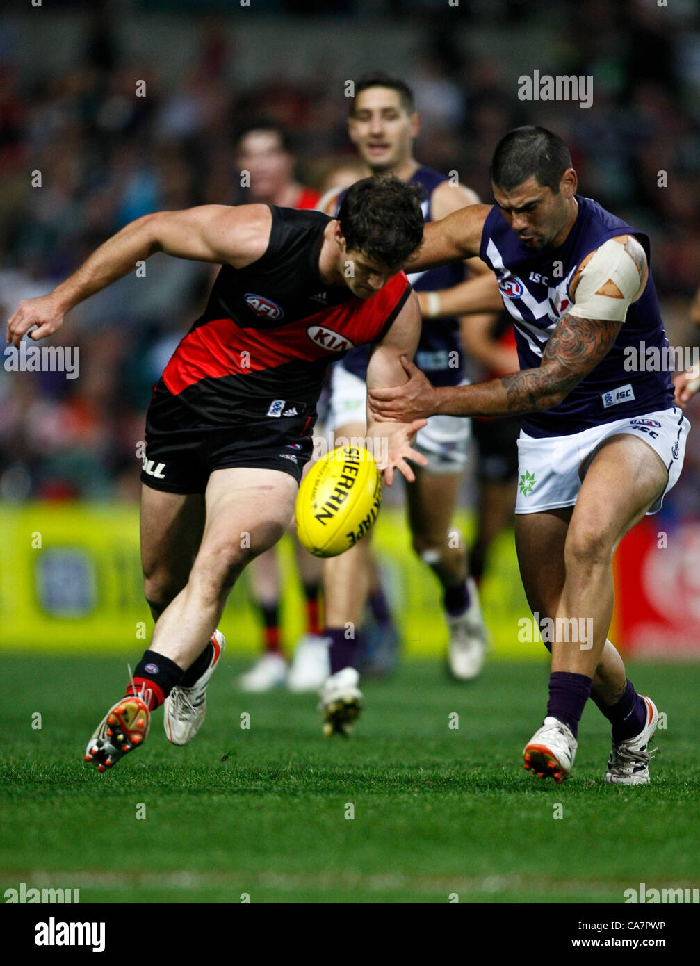 23.06.2012 Subiaco, Australia. Fremantle v Essendon. Ben Howlett fights ...