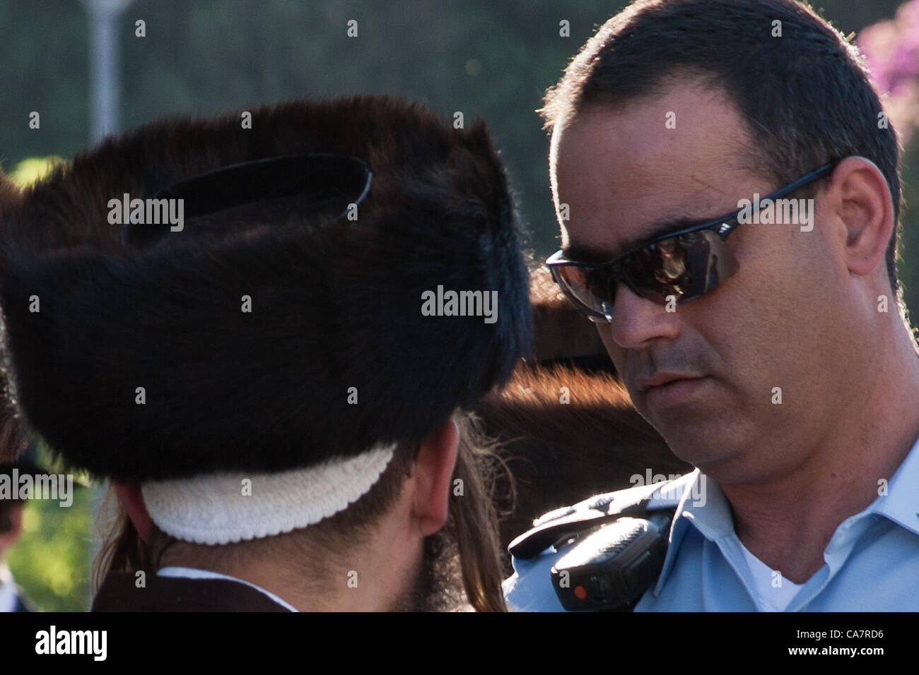 Police officer gives Haredi protester an up-close, stern, look ...