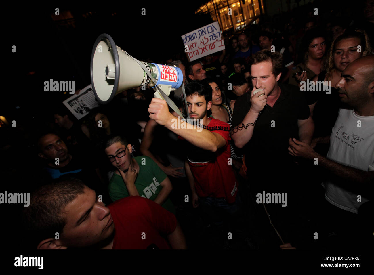 An Israeli demonstrator shouting anti government slogans through a loud ...