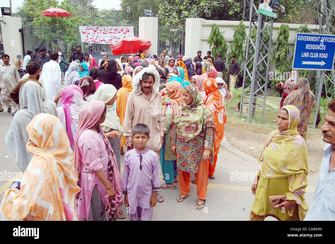 Poor people gather outside government office at club road submitting ...