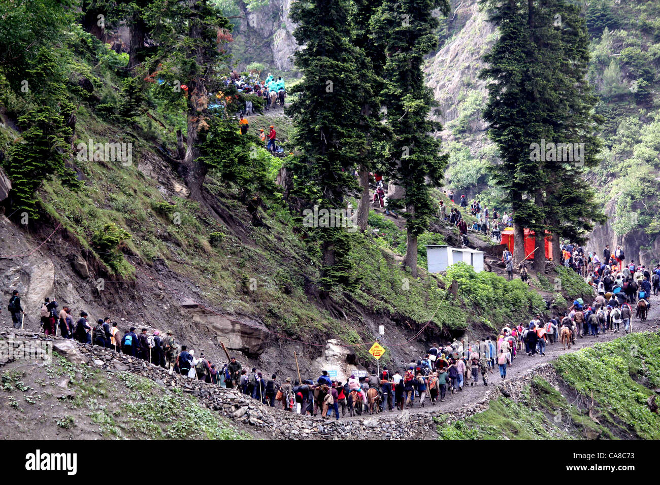 Hindu pilgrims trek to the Amarnath cave during a pilgrimage near ...