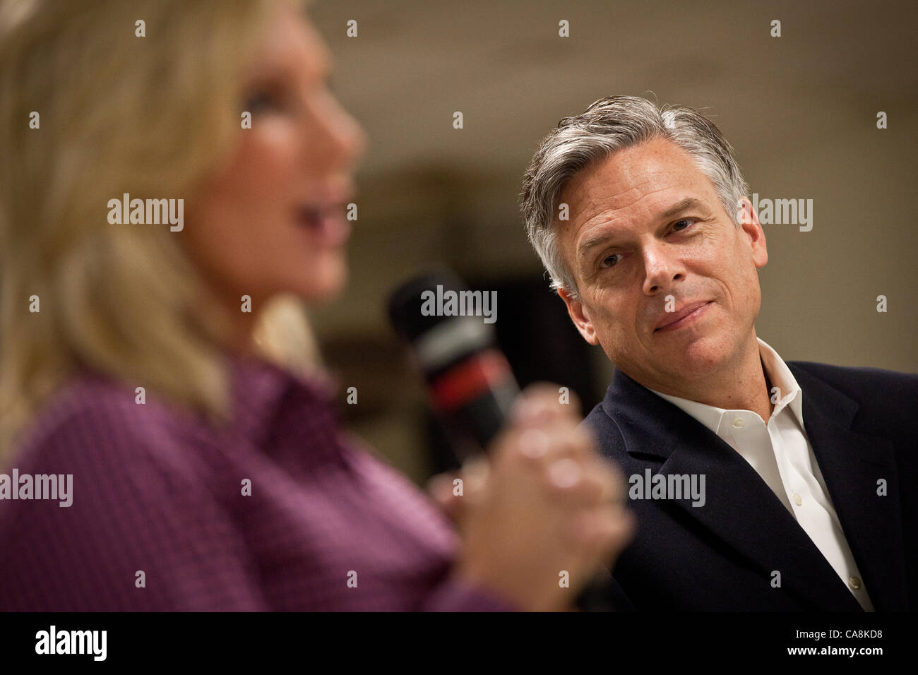 Republican presidential candidate Gov. Jon Huntsman listens as his wife ...