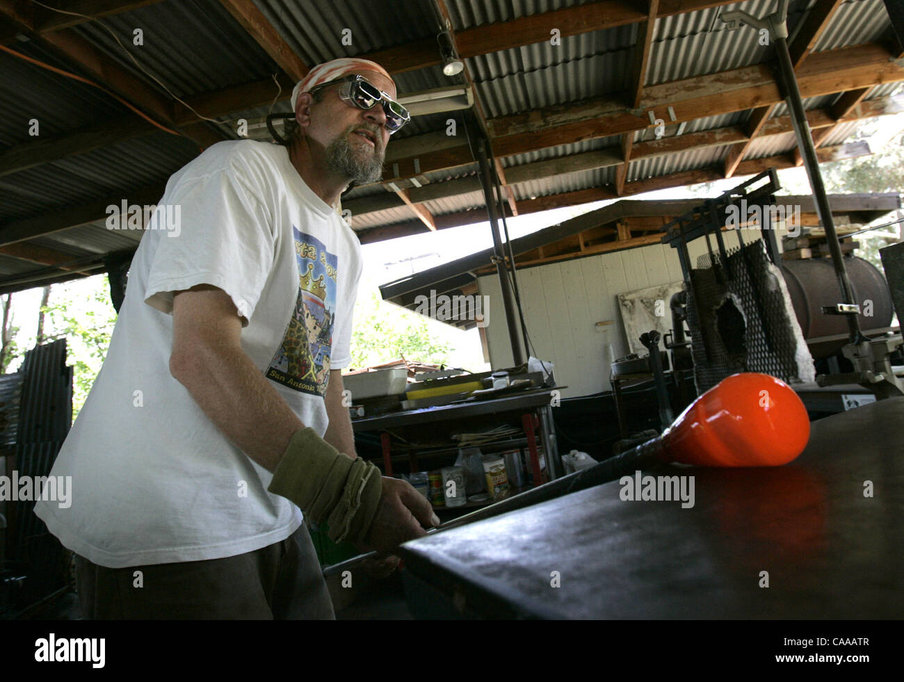 Fallbrook glass artist Bruce Stowell prepares a decorative glass in his ...