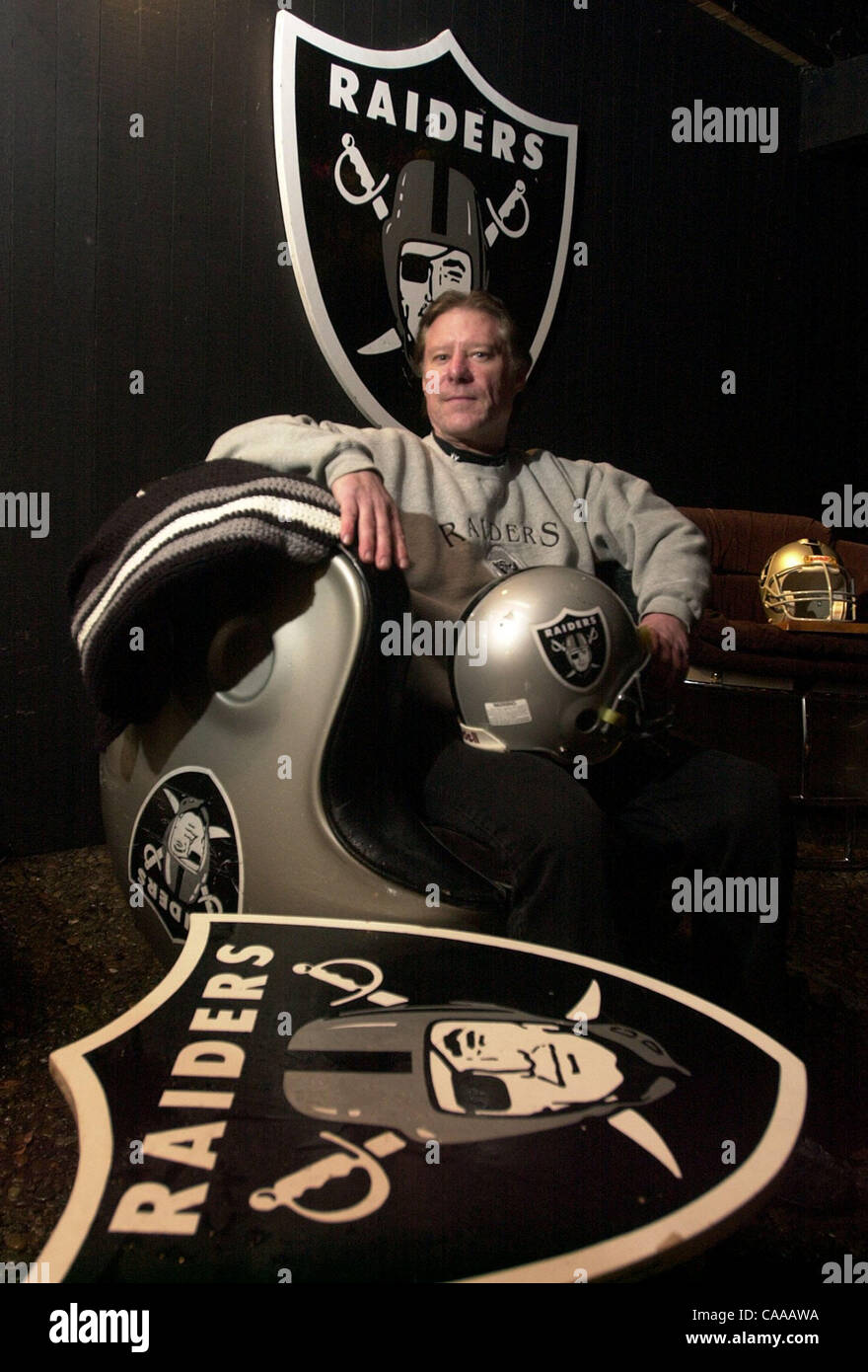 Richard Oliver,who is a big Oakland Raiders fan, sits on his patio with ...