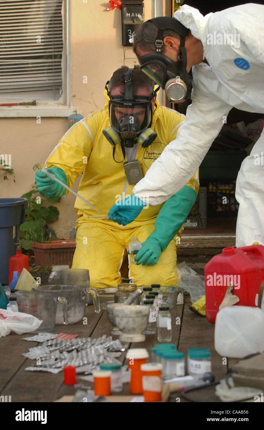 Alex Taflya, left, a criminalist for the Sheriff's department, and a ...