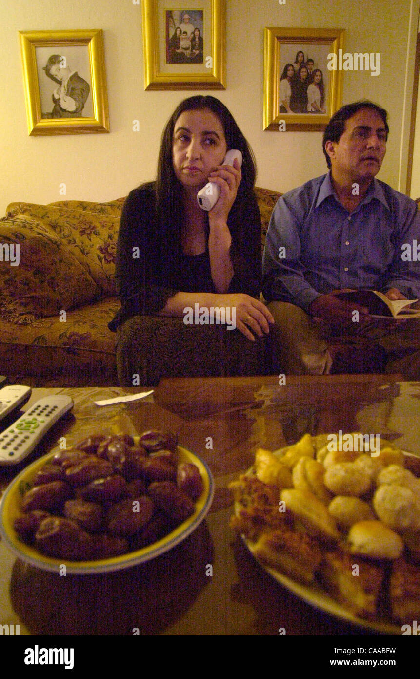 (PUBLISHED 04/04/2003, B-1:1,7): Aziza Akrawi, left, calls relatives in ...