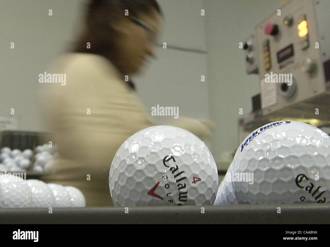 Published 6/16/2004, C-3, UTS1814017) Maricruz Lopez places logos on HX ...