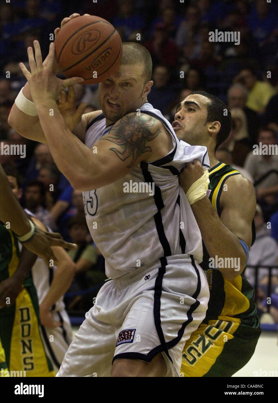 (Published 03/10/2003, C-1) San Francisco's James Bayless (right) fouls ...