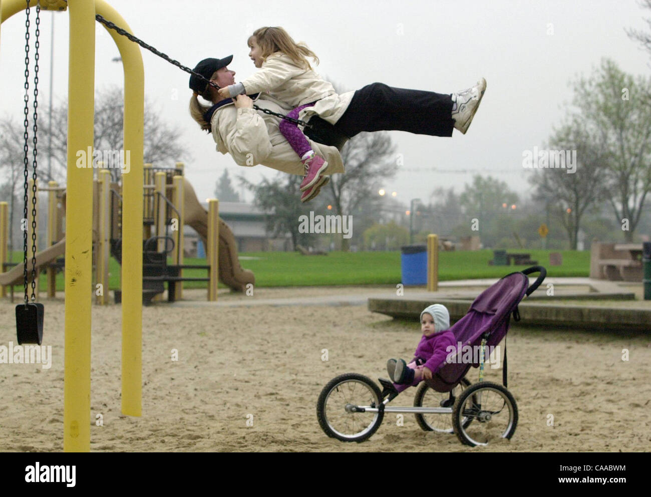 Sarah Gosling (cq) and her daughter (on swing) Abby Lieblich (cq),4 ...