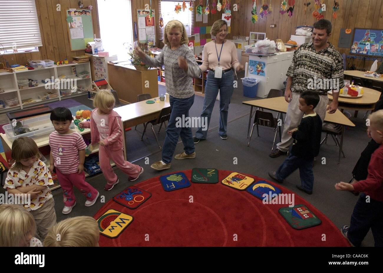 (published 11/04/2004, NC-6, NI-10) Marcia Stanley, left, at center ...