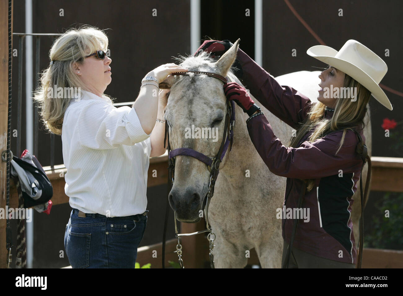 Nancy Tarsha (right) works with Jean Carstensen during a lesson on ...