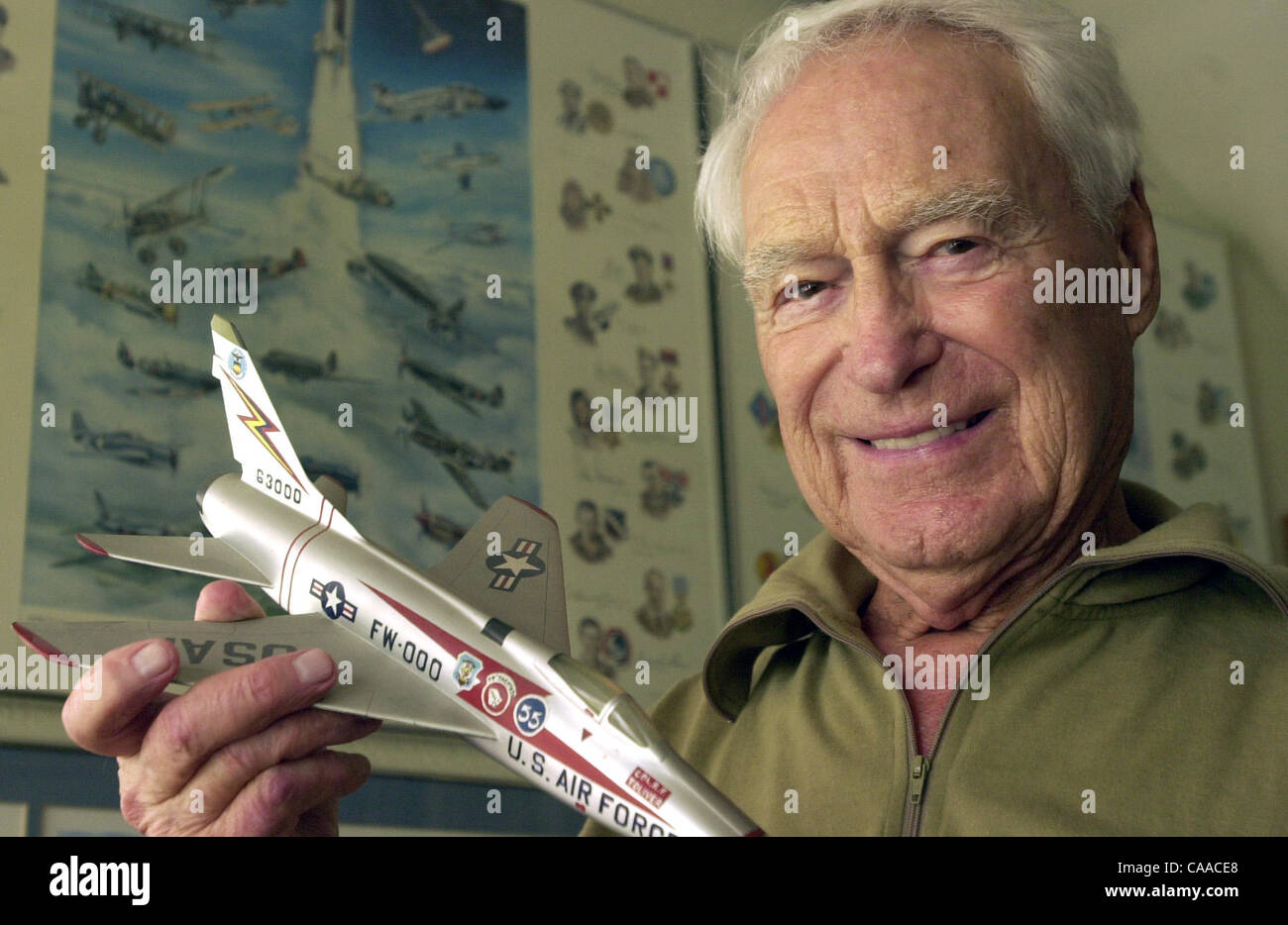 (Published 05/24/2003, NC-6) Pilot Ray Toliver holds F100 jet model ...