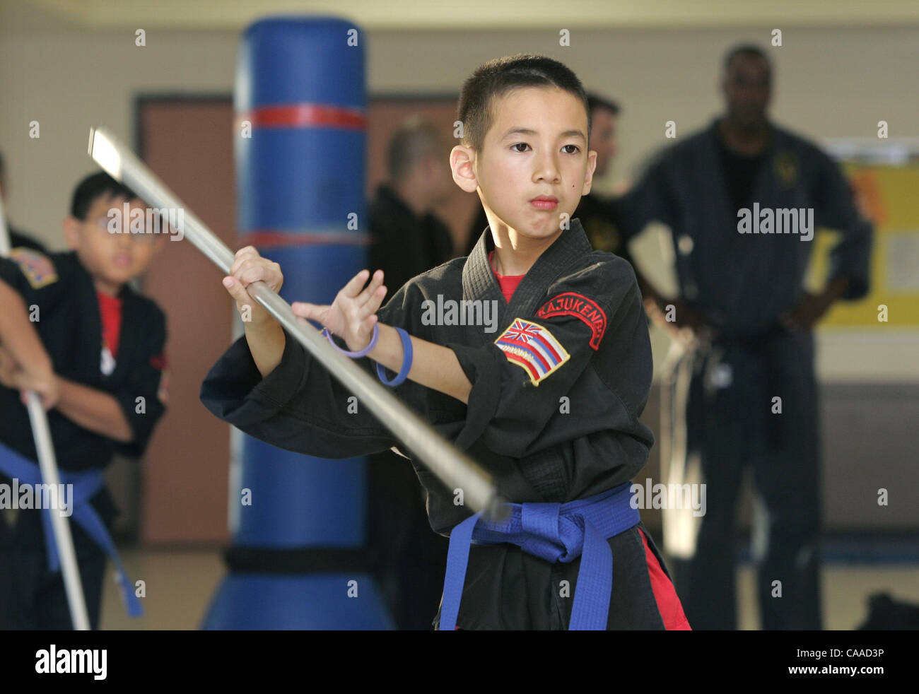 Martial arts student NICHOLAS LUONG, 9, works out with the staff during ...