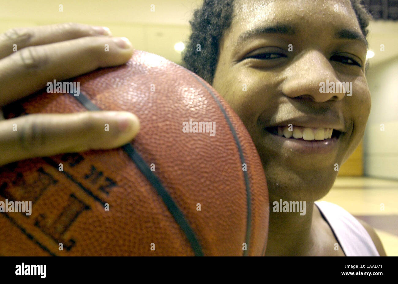 (Published 02/14/2003, NC-14; NI-12) Jeremy Cross holds a basket ball ...