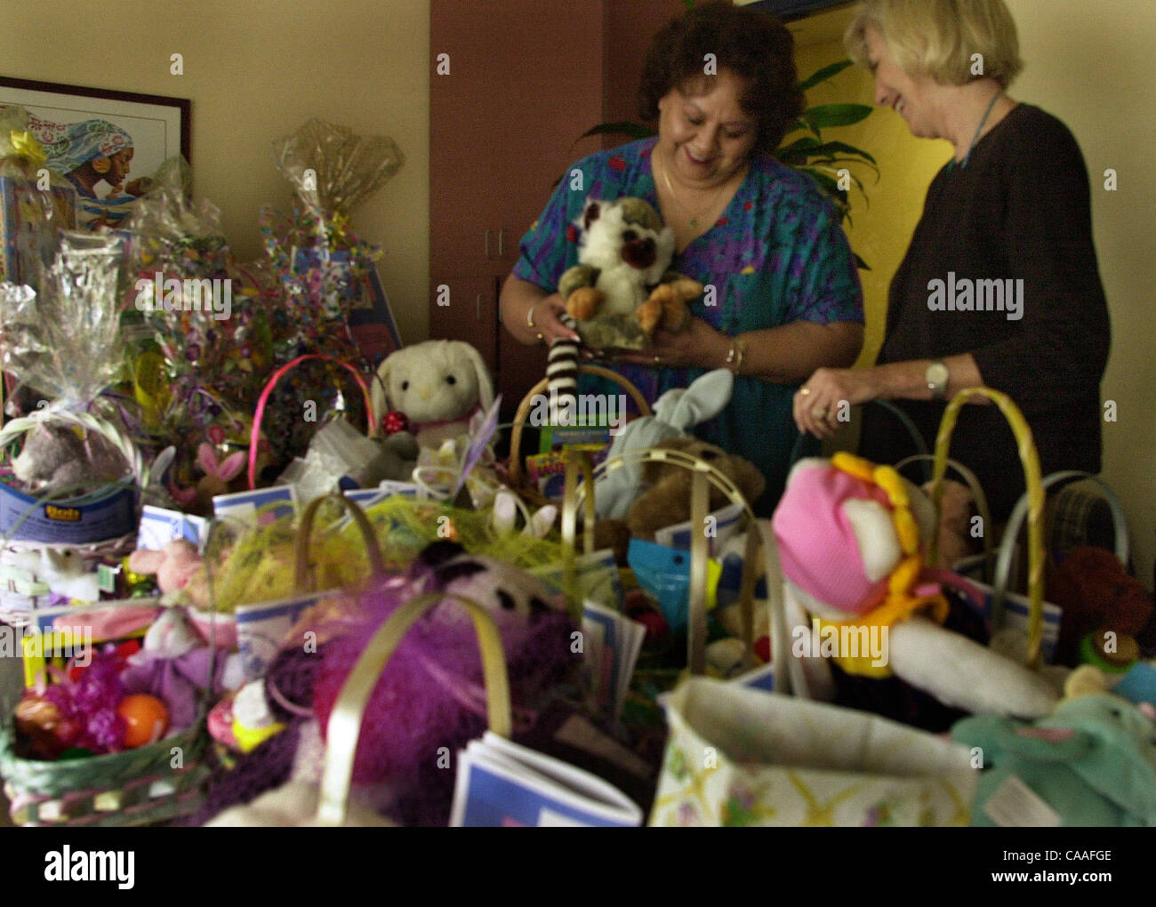 (Published 04/17/2003, E-4) Maria Elena Dang (cq) (left) and Jeannie ...