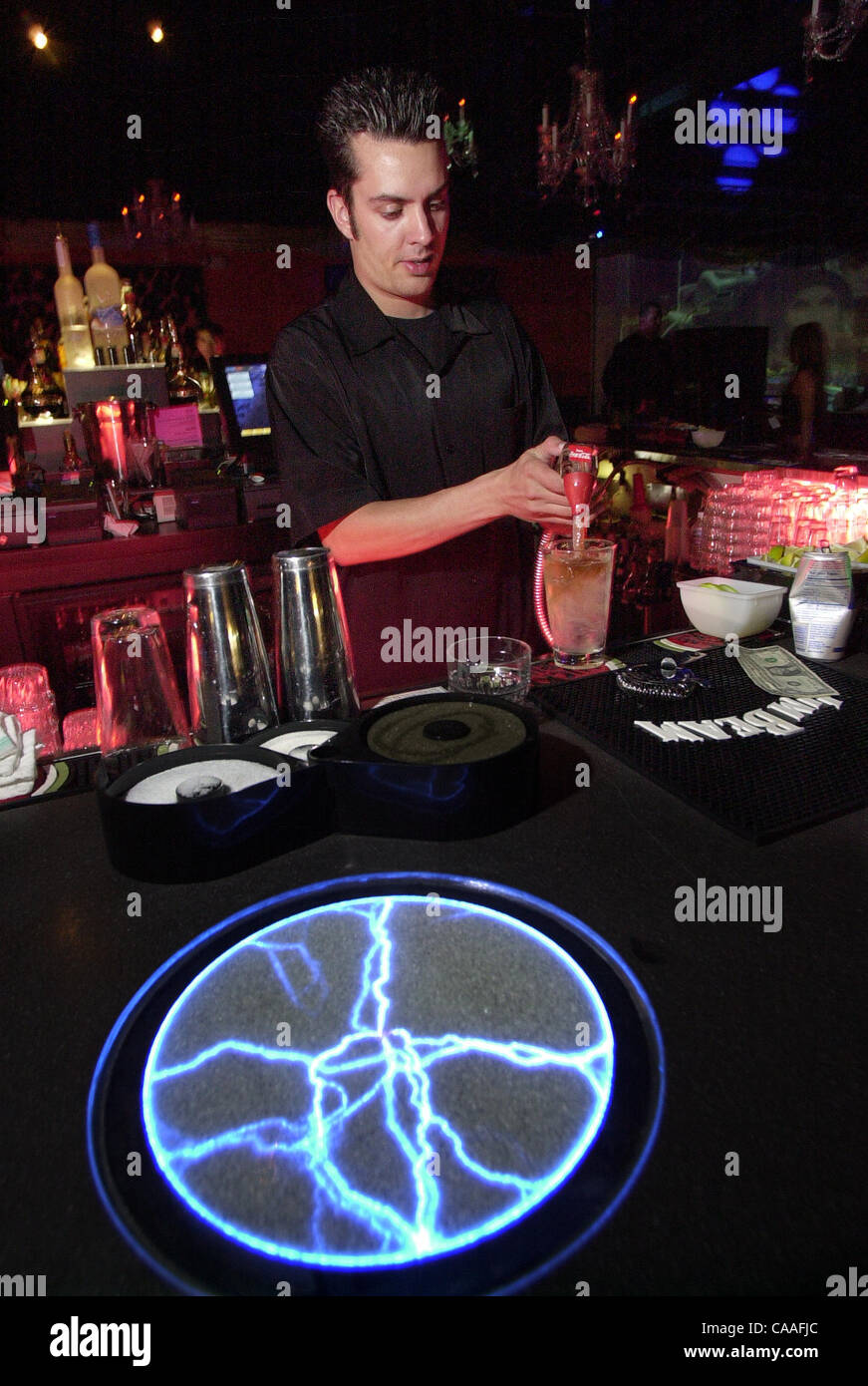Bartender Kelly Kernan mixes a drink at the L5 club in the Gaslamp ...