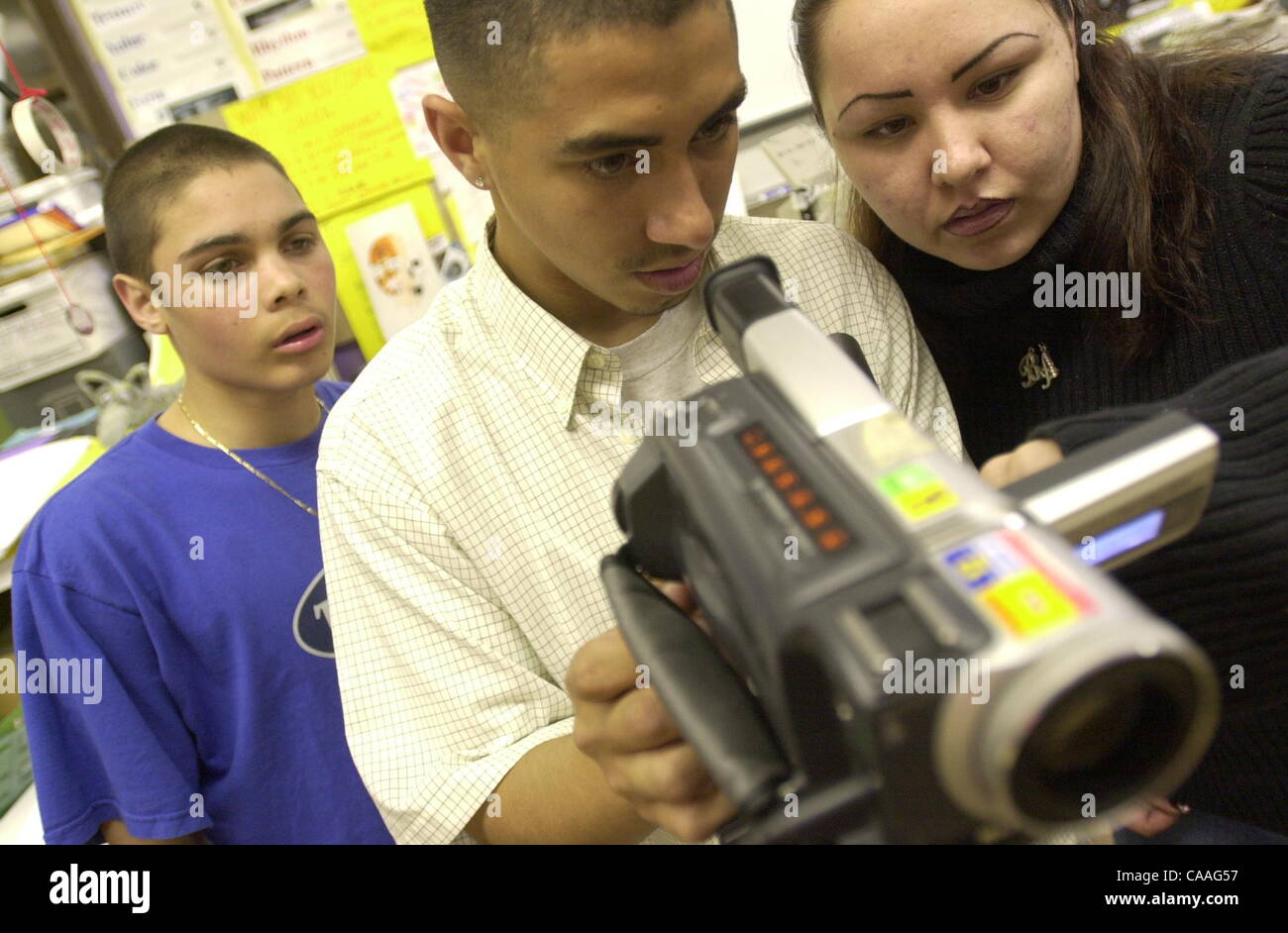(Published 05/24/2003, B-1:6) L-R: Paul Becerra, 17; cameraman ...