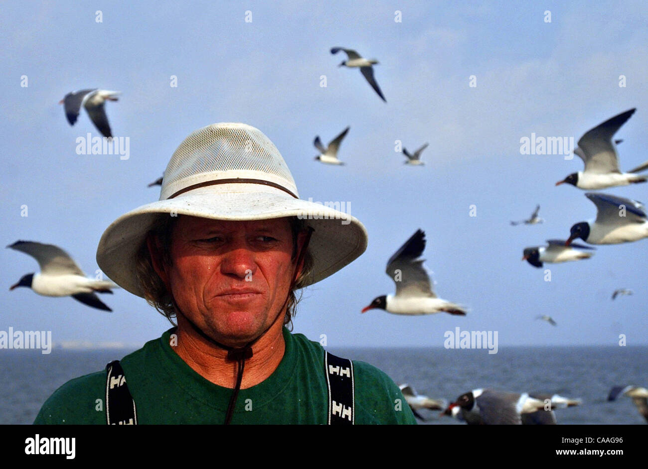 Ernie Butler pauses for a moment while bait fishing in Corpus Christi ...