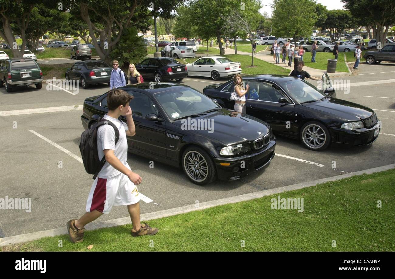 (Published 6/23/2004, A-1, UTS1815411) Teenagers in the student parking ...