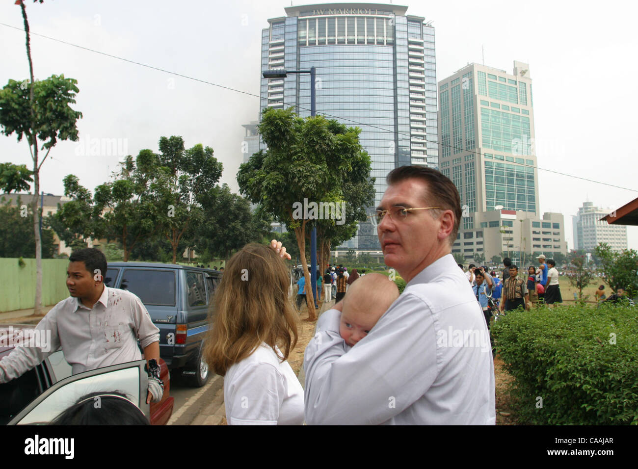 JAKARTA, INDONESIA AUGUST 5, 2003: A terrified expatriate holding his ...