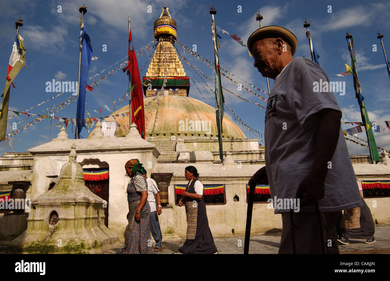 KATHMANDU, NEPAL- AUGUST28, 2003- A Tibetan Buddhist pilgrim walks in a ...