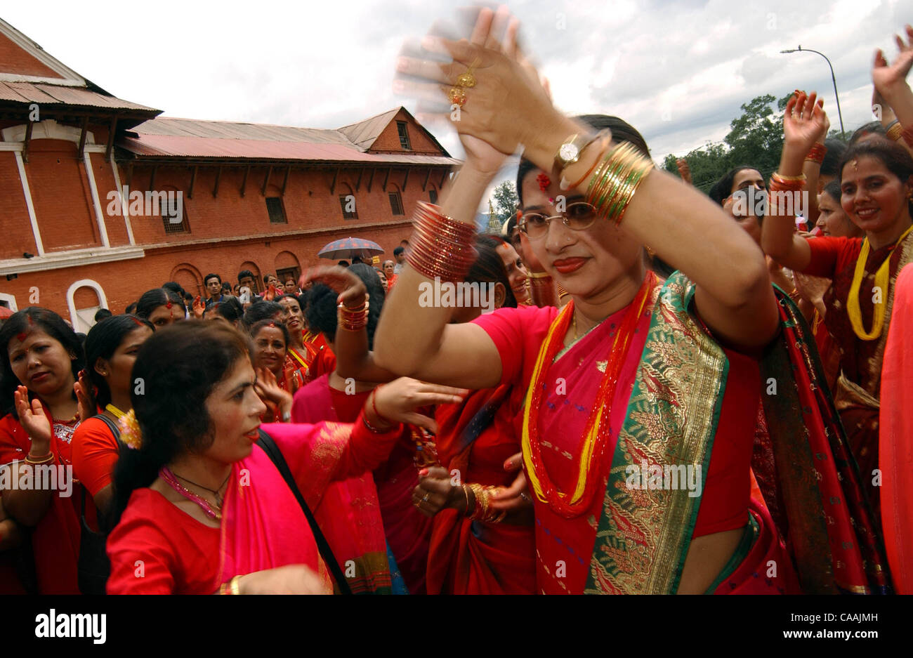 KATHMANDU, NEPAL-AUGUST 30, 2003: A Nepali woman dances at Pasupatinath ...