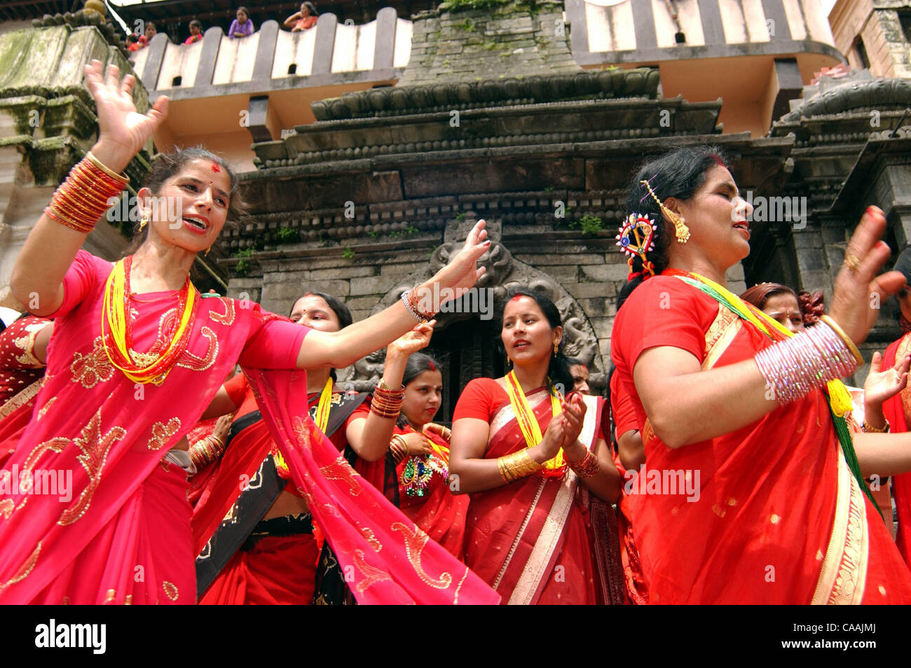 KATHMANDU, NEPAL-AUGUST 30, 2003: A Nepali woman dances at Pasupatinath temple to celebrate Teej ...