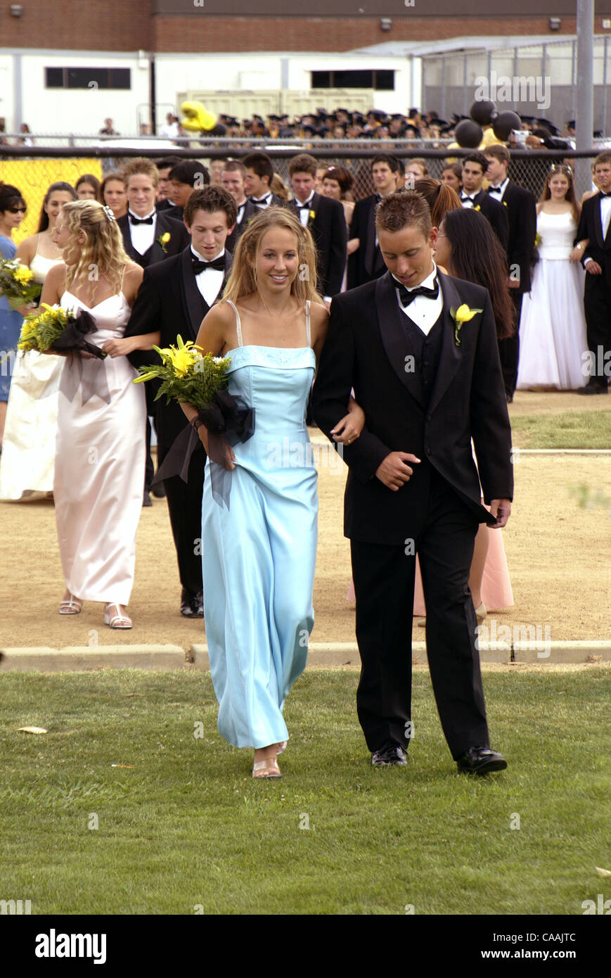 Formally-dressed members of the junior class lead the graduation ...