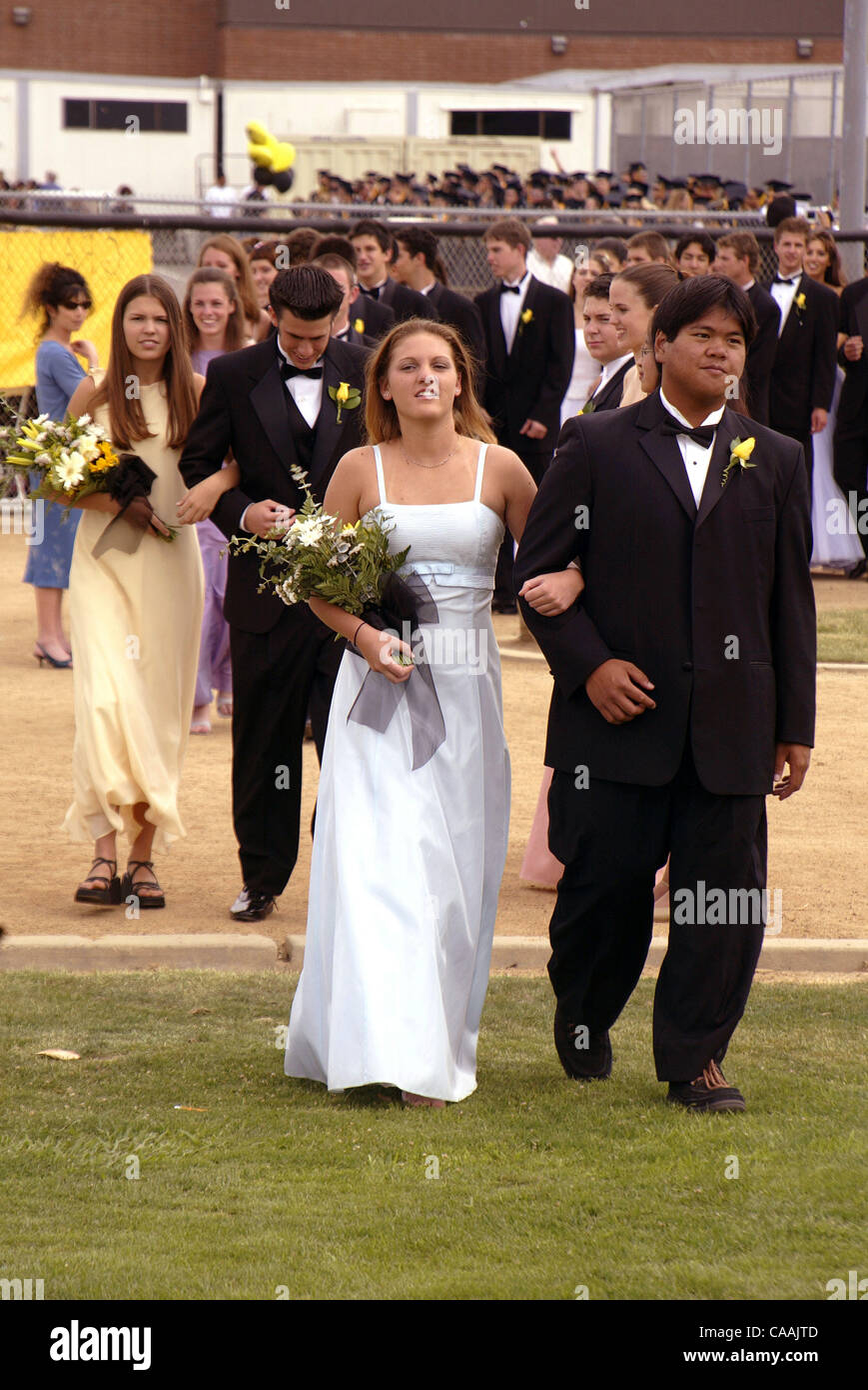 Formally-dressed members of the junior class lead the graduation ...