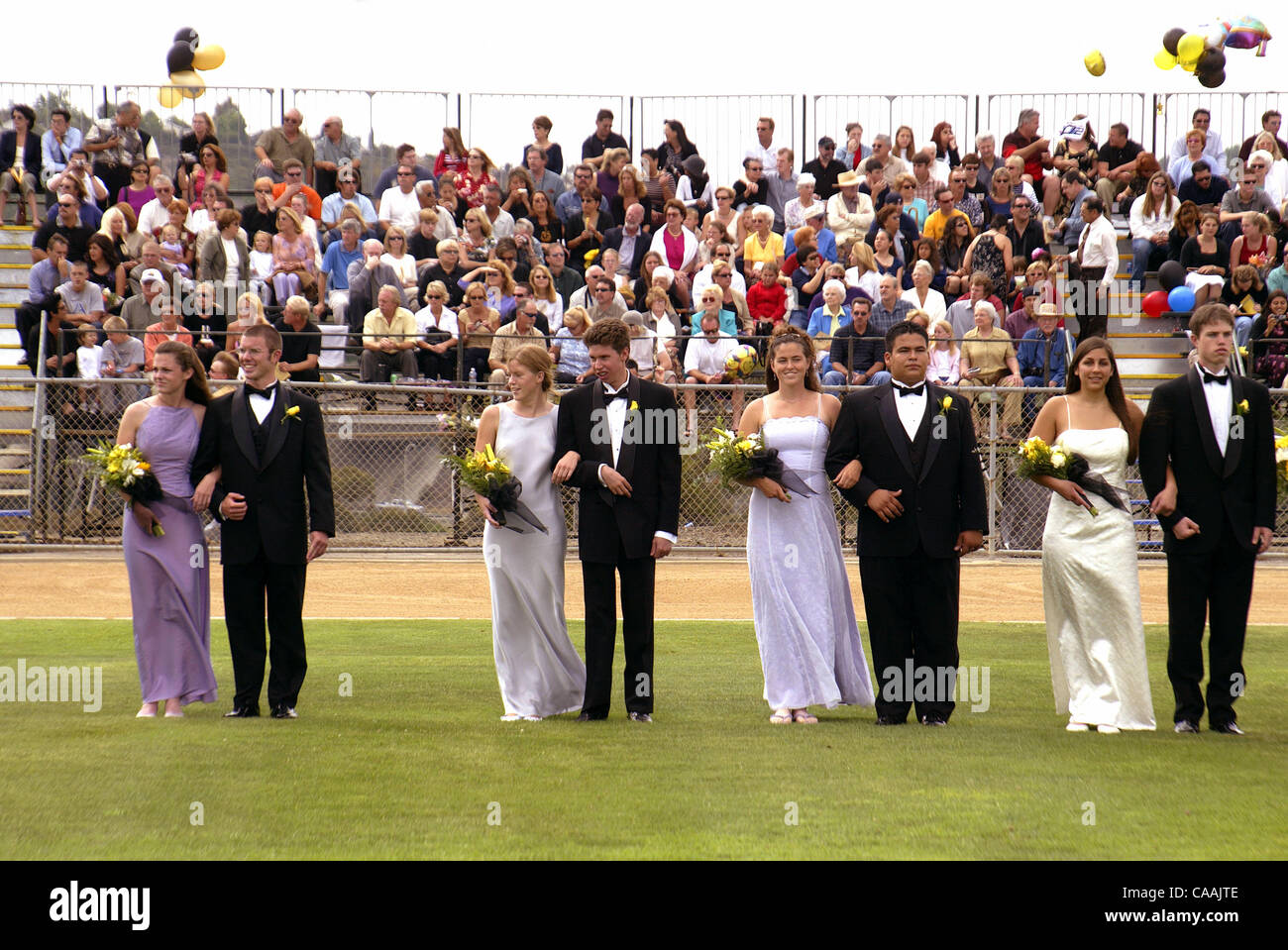 Formally-dressed members of the junior class lead the graduation ...