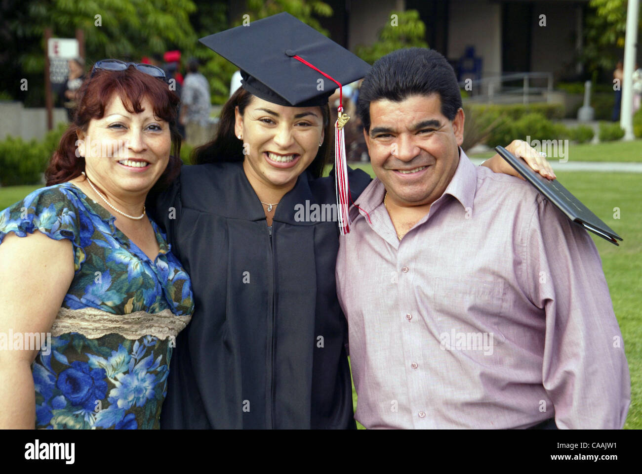A Hispanic mom graduates from Long Beach (CA) City College: Mother with ...
