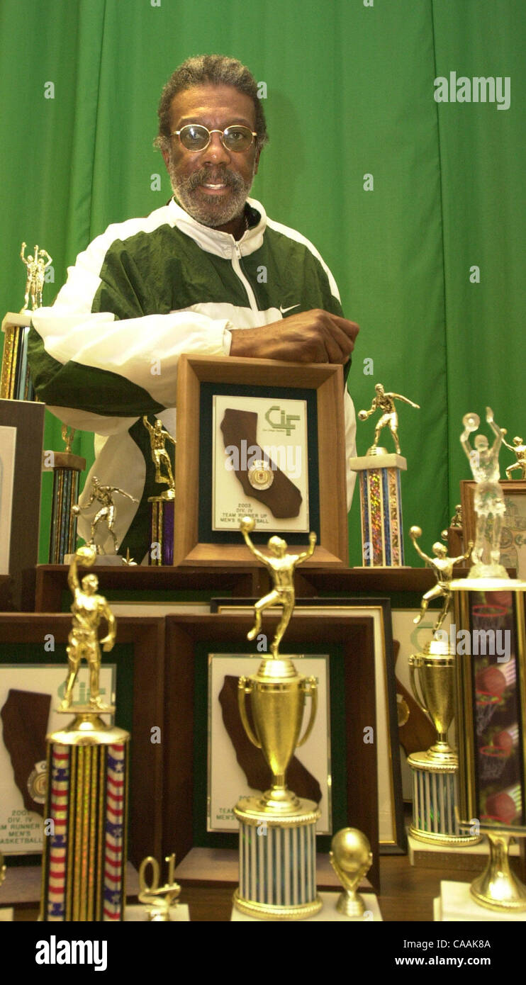 (Published 06/18/2003, D-1): Basketball coach Charlie Paulk w/trophies ...