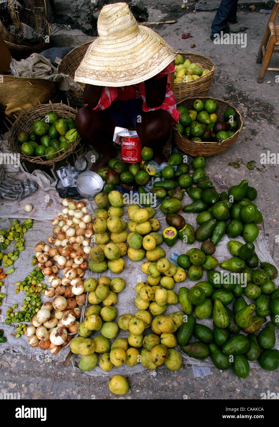 FOR METRO - A haitian woman sells fruits and vegetables on a street in ...
