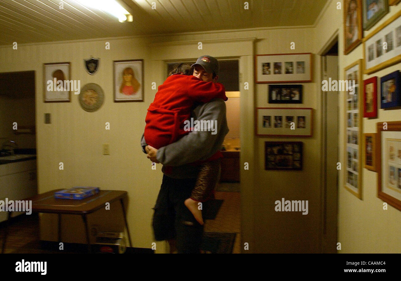 5:19 a.m.--Single father Luke Crespan carries his 7-year-old daughter ...