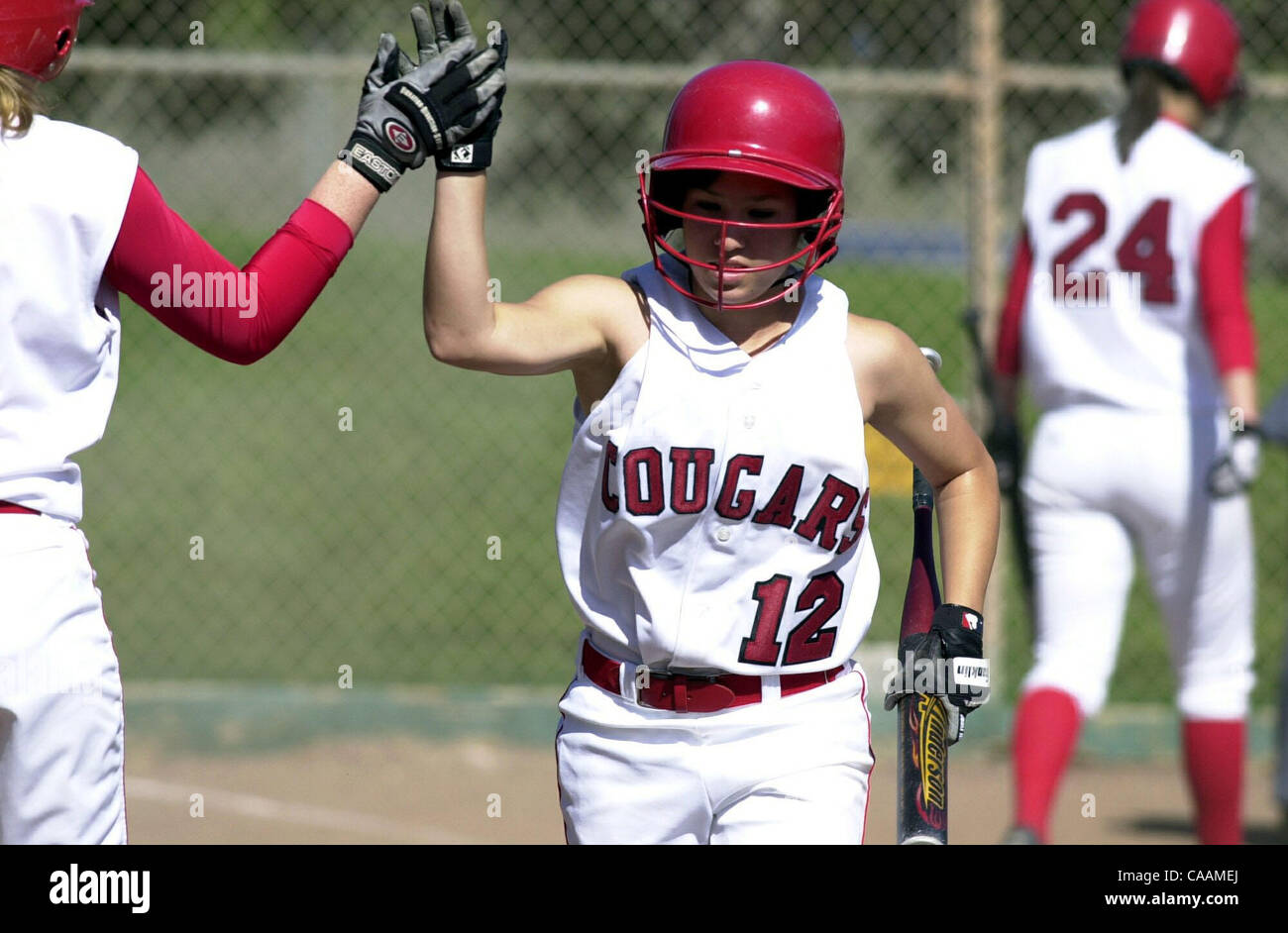 Carondelet High School's Nicky Yee gets a high five after scoring the ...