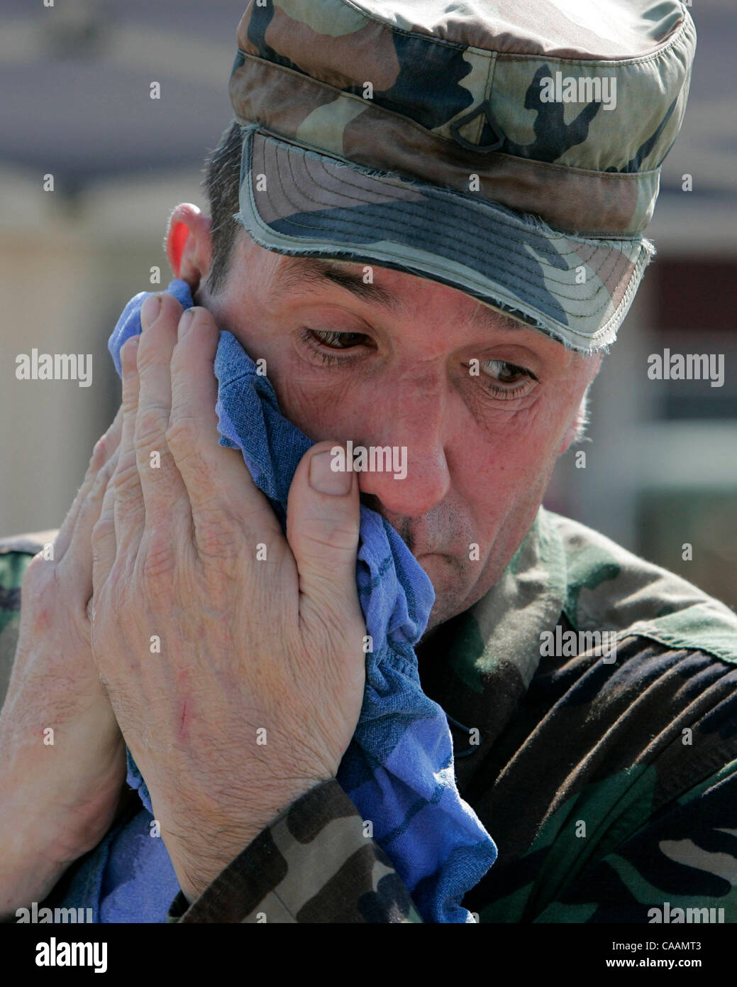JOSEPH LAROCCO, of the Texas National Guard, wipes his face with a wet ...