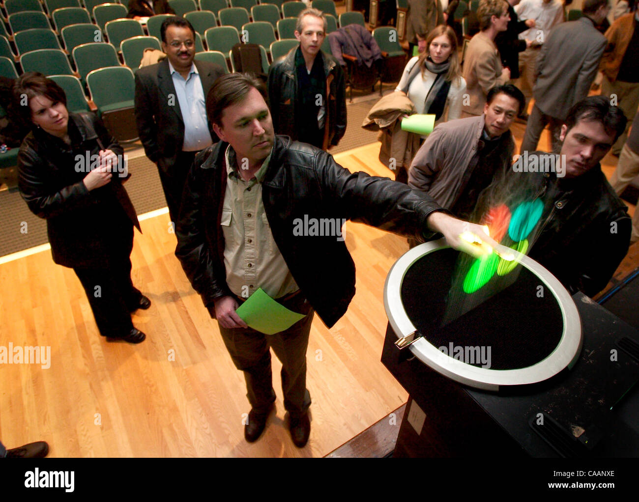 Michael Root checks out a heliodisplay, a machine that projects an ...