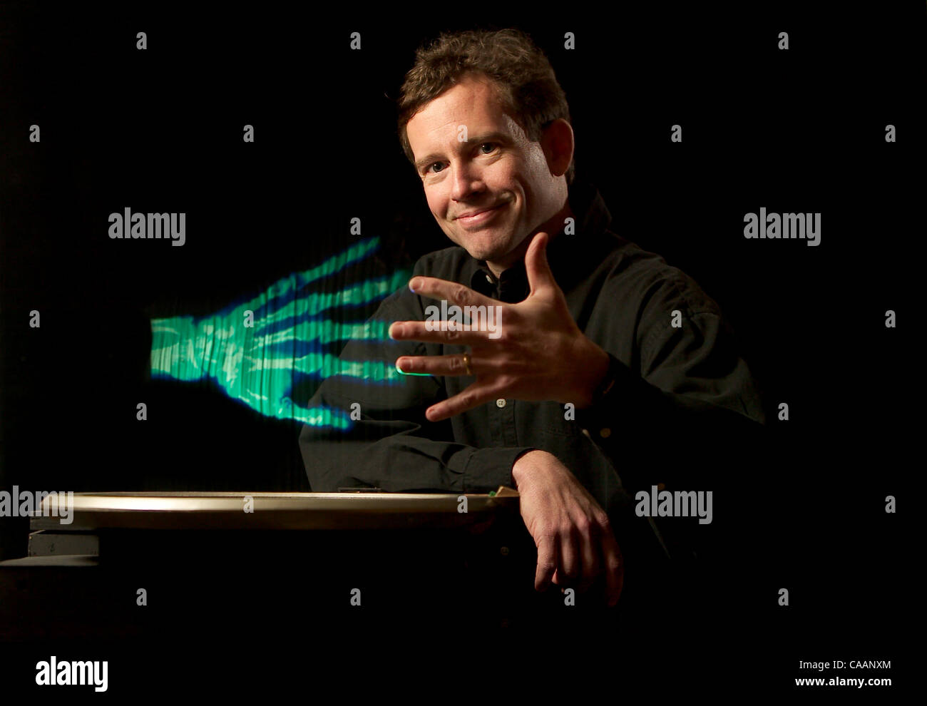 Michael Morton poses with a Heliodisplay in Lake Forest, Ill., Friday ...