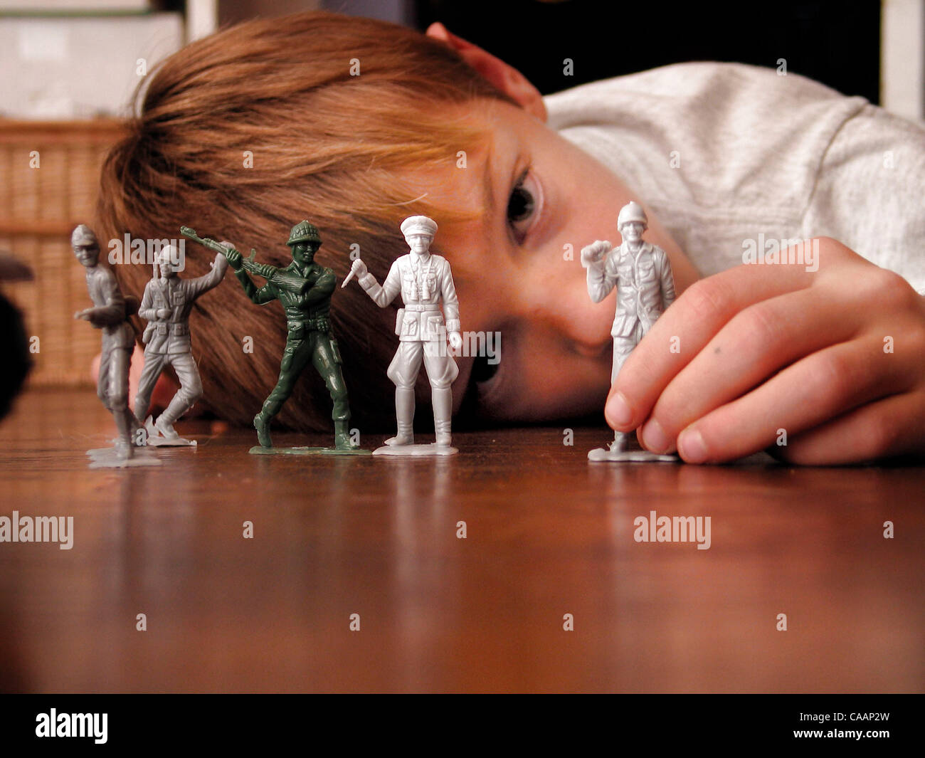 Dec 20, 2003; Mill Valley, CA, USA; Two boys play with their Army ...