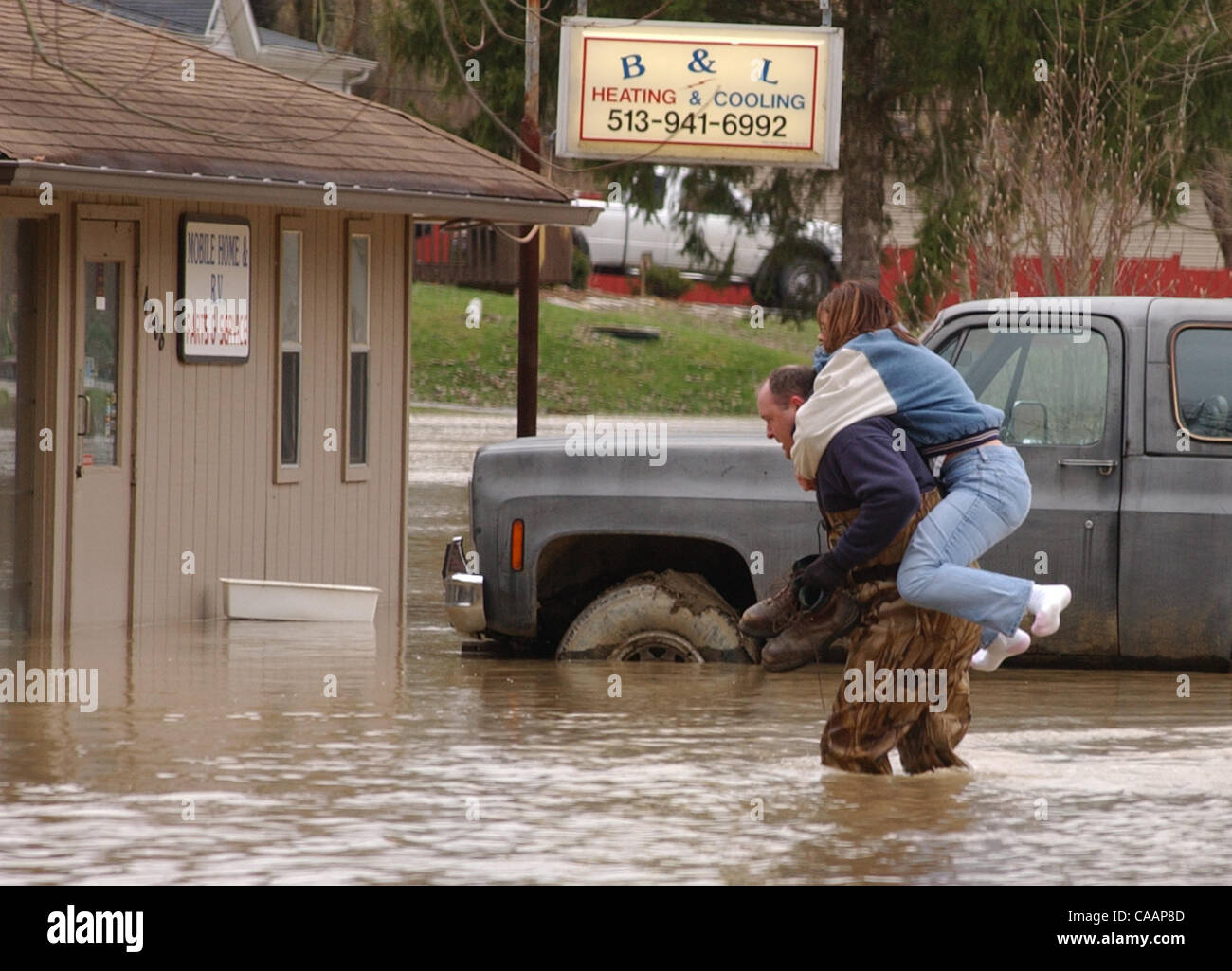 Jan 05, 2004 - Miami Township, Ohio, USA - SCOTT FULTZ carries his wife ...