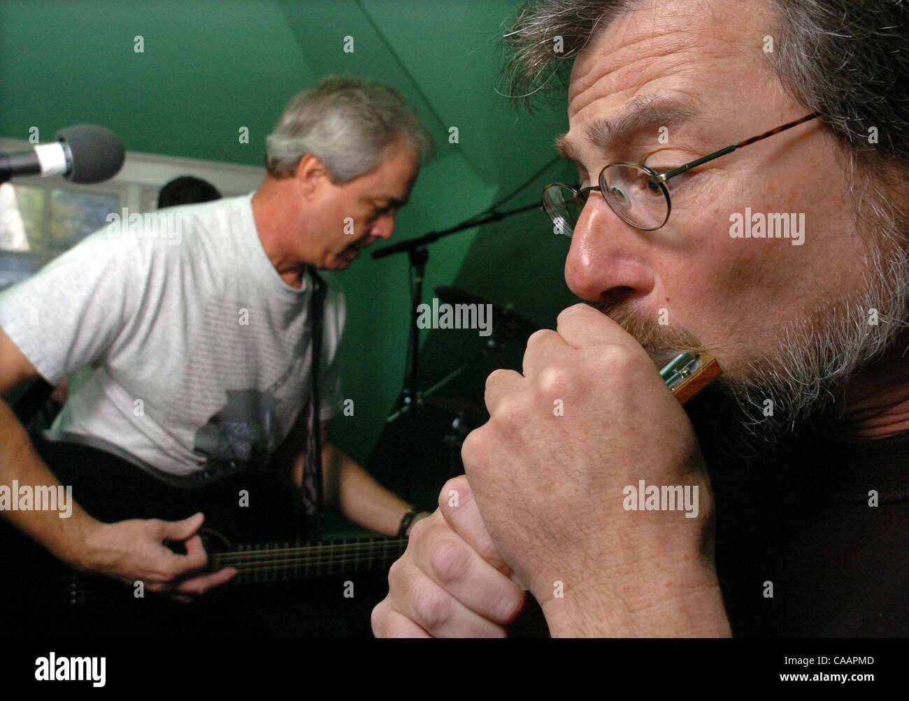 Stone Soup, a rock band made up mostly of guys in their 50's, rehearses ...