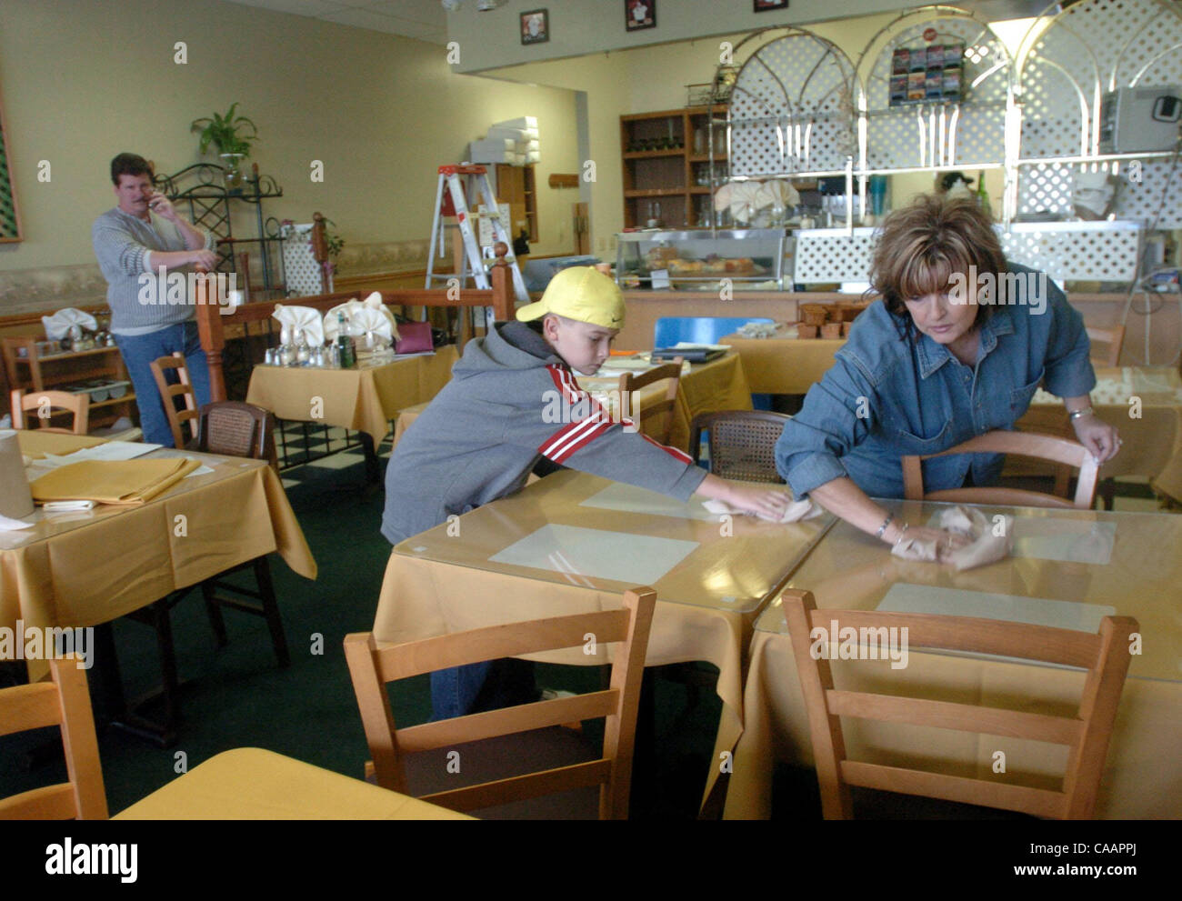 Vicky (right) and Justin Fagan cq wipe down tables while Mike Fagan cq ...