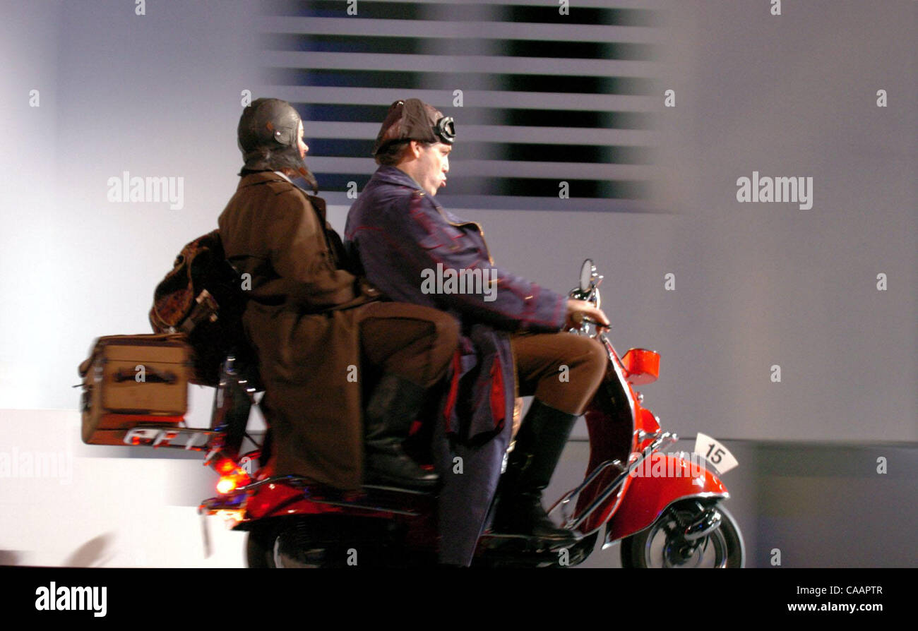 Thomas Hampson as Figaro drives a vespa onto stage in Rossini's "Barber ...