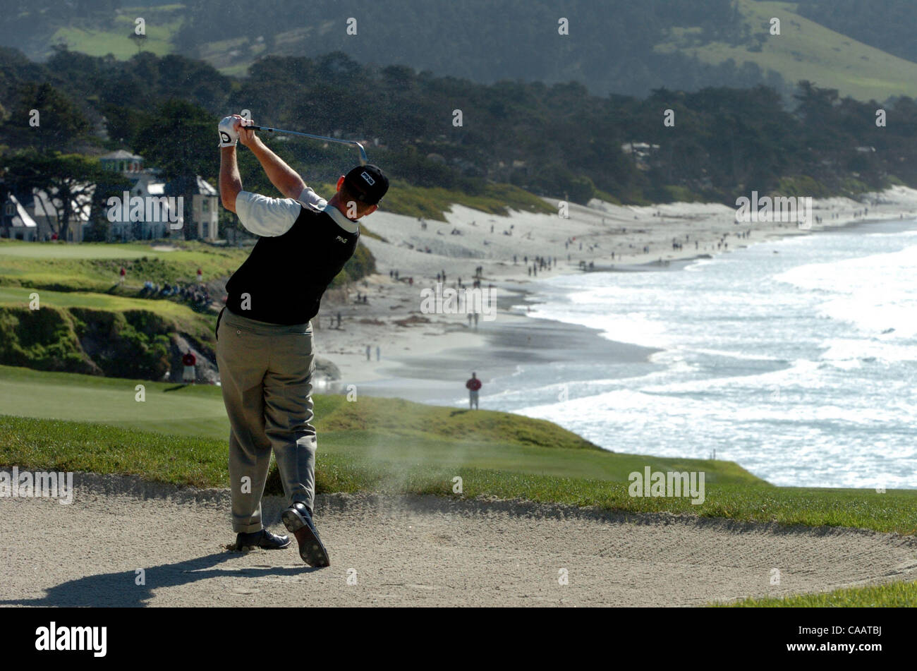 Jeff Maggert watches his shot from a sand trap on the 9th hole of ...